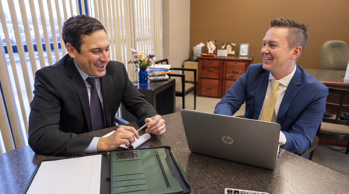 mortgage banker laughing with customer